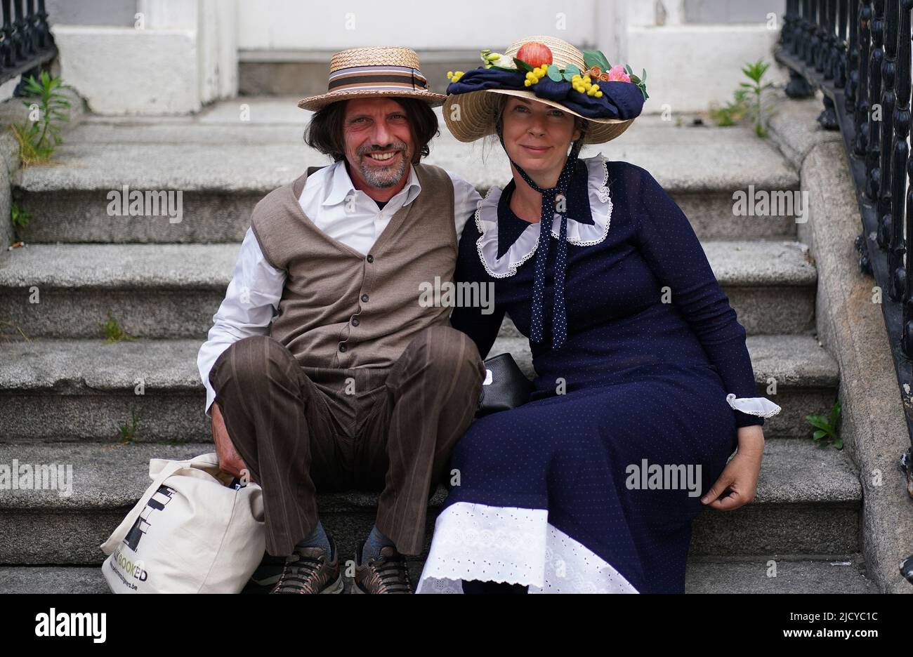People take a rest on steps in Dublin's city centre as Bloomsday ...