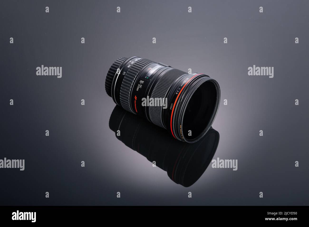 Lens on a piece of black acrylic Stock Photo - Alamy