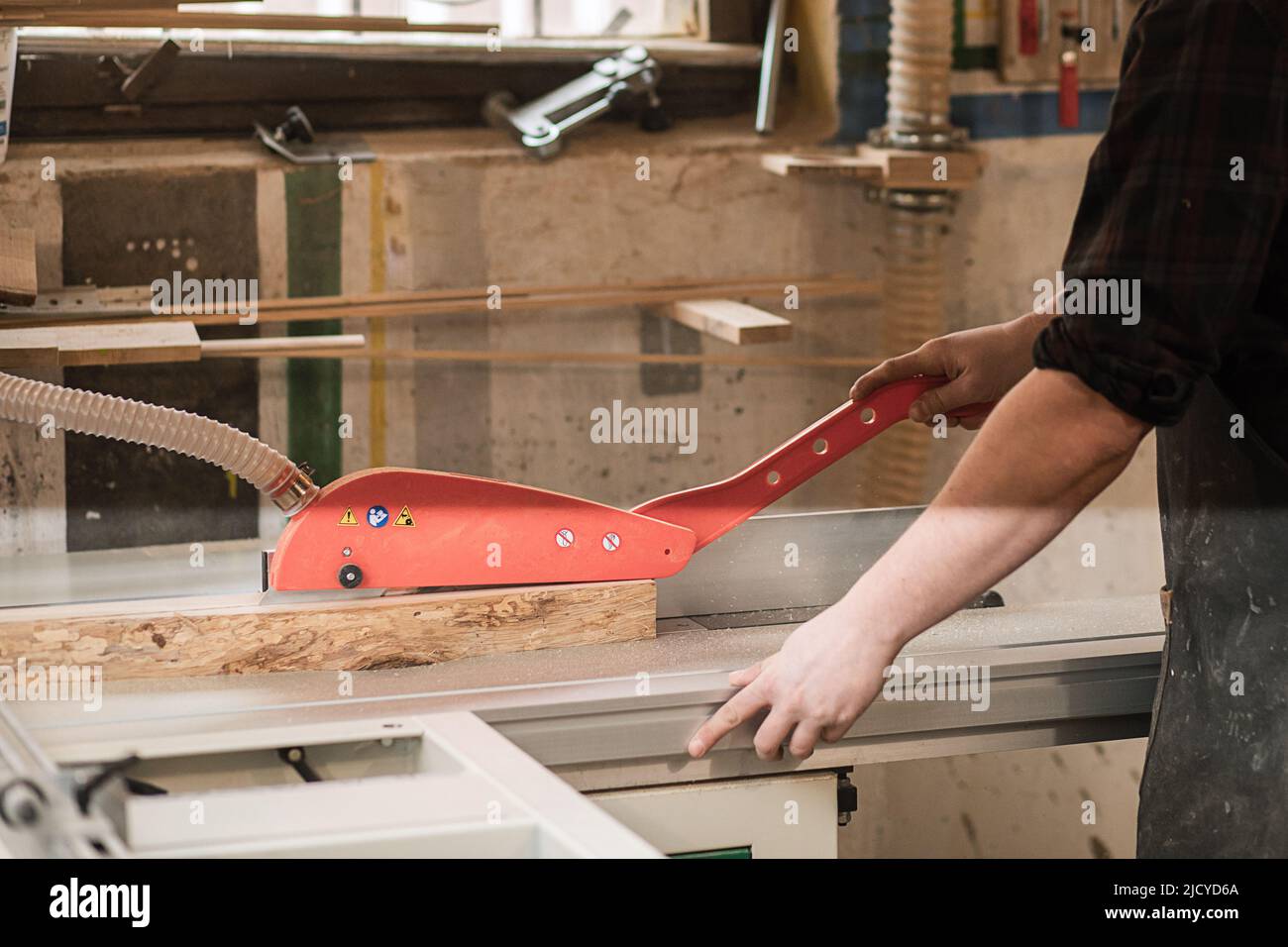 Closeup of unrecognizable male carpenter hands use metal planning ...
