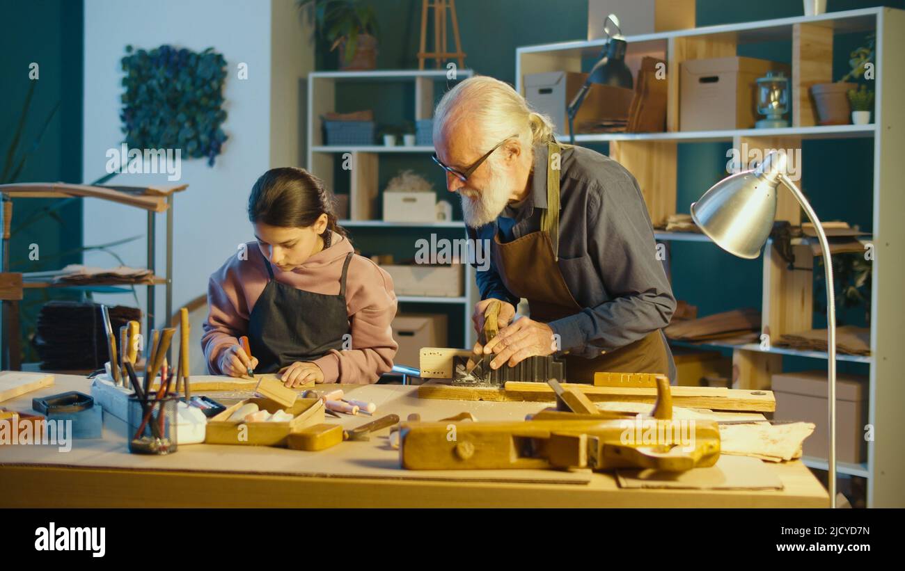 Girl with Carpenter Grandfather Learning to Work with Wood with ...