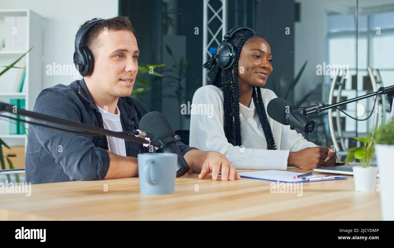 Commentator talking speaking into microphone hi-res stock photography ...