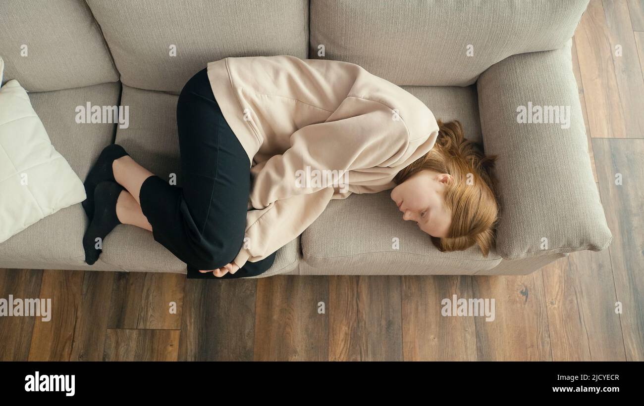 View From Above. A Pensive Red-haired Girl is Sad Alone. A Depressed ...