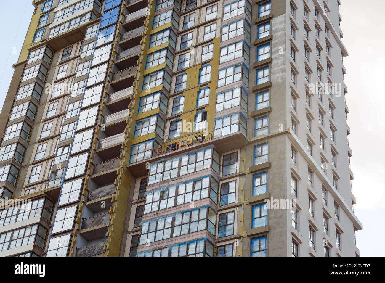 Contemporary high-rise apartment buildings, frame-block house under ...