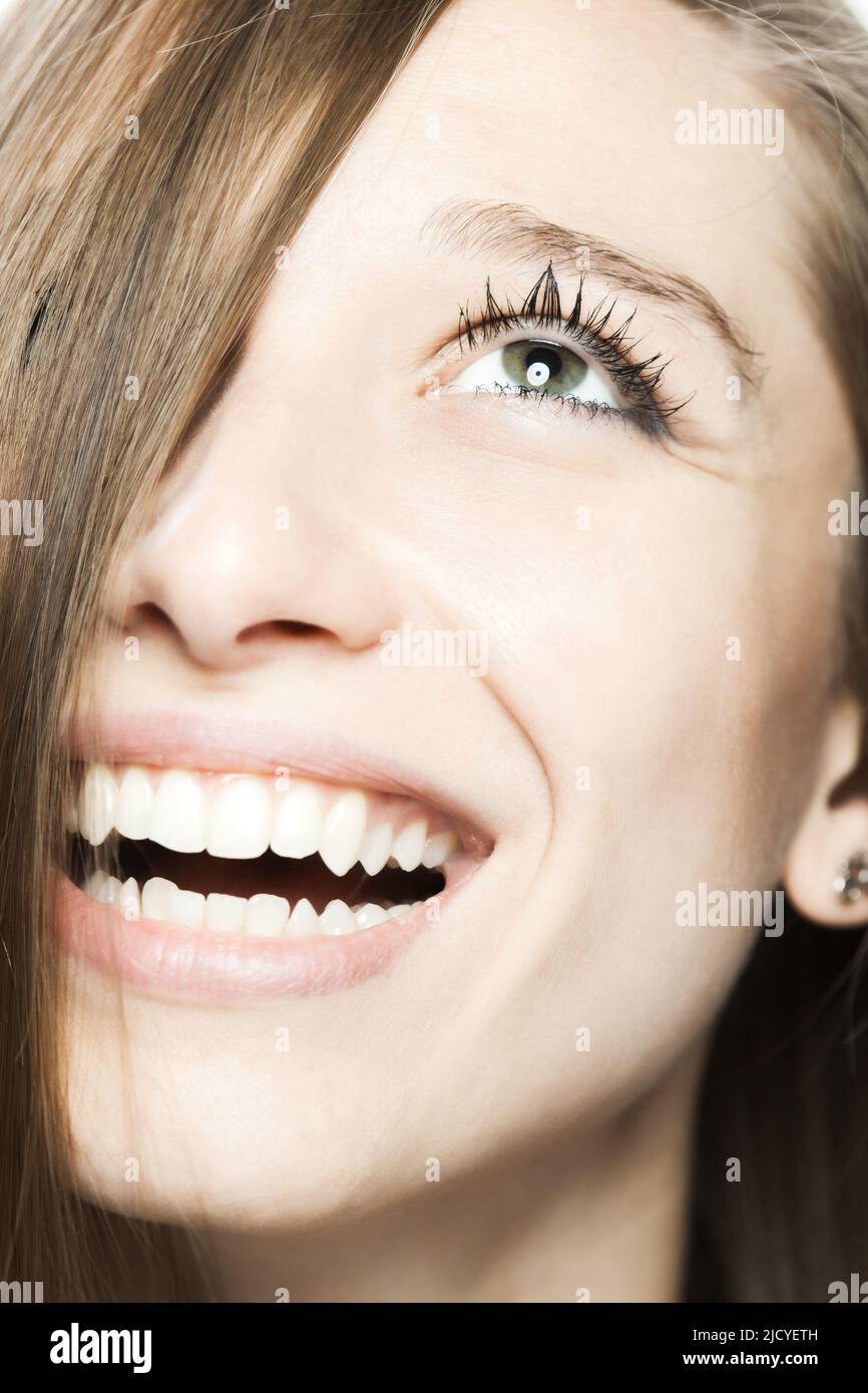 close up studio face portrait of a beautiful brunette girl with happy ...