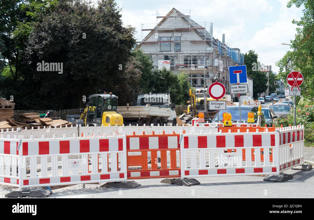 Road construction site with barriers and building a house Stock Photo ...