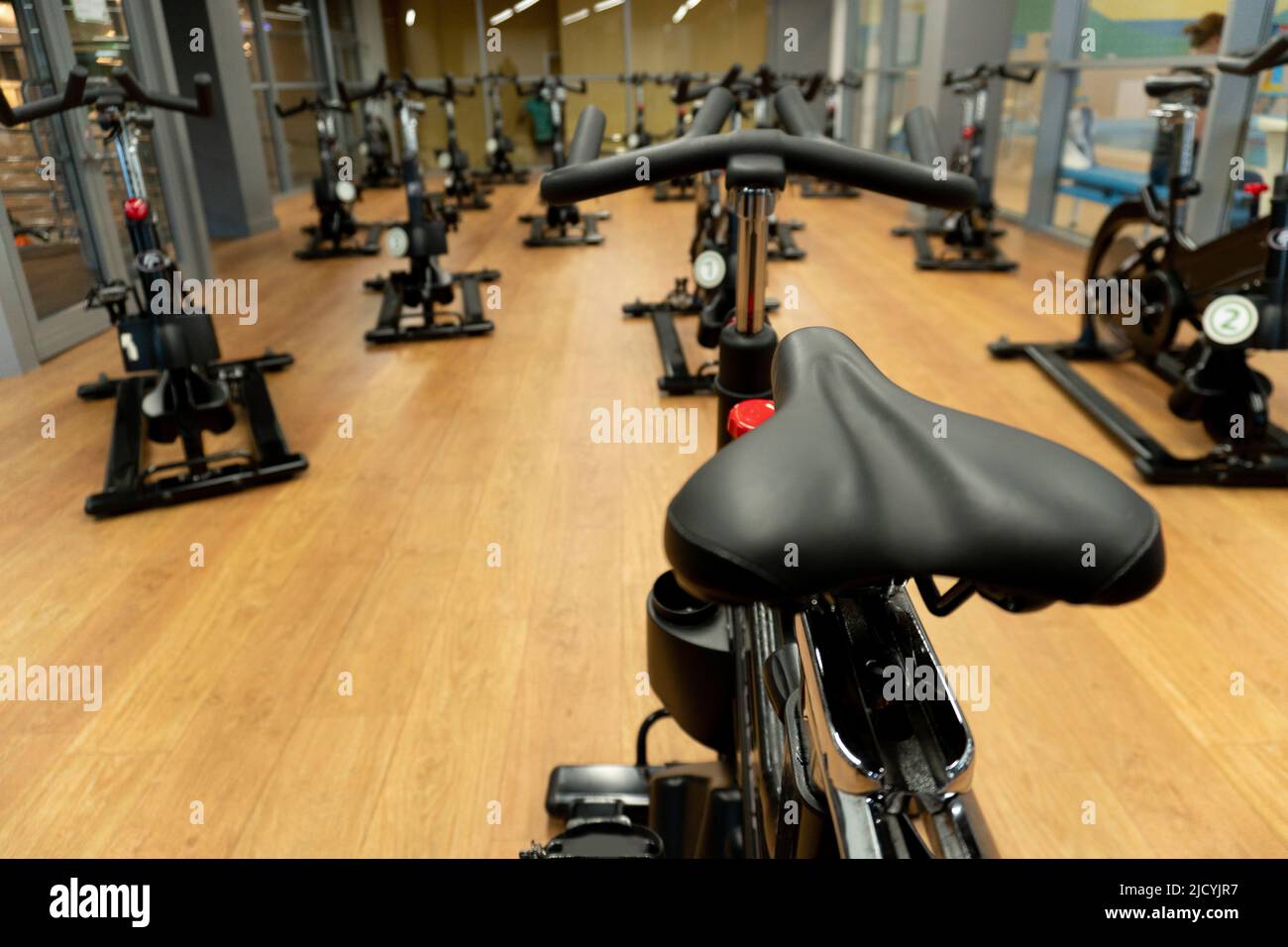 Group exercise background seat simulator bike black white gym isolated ...