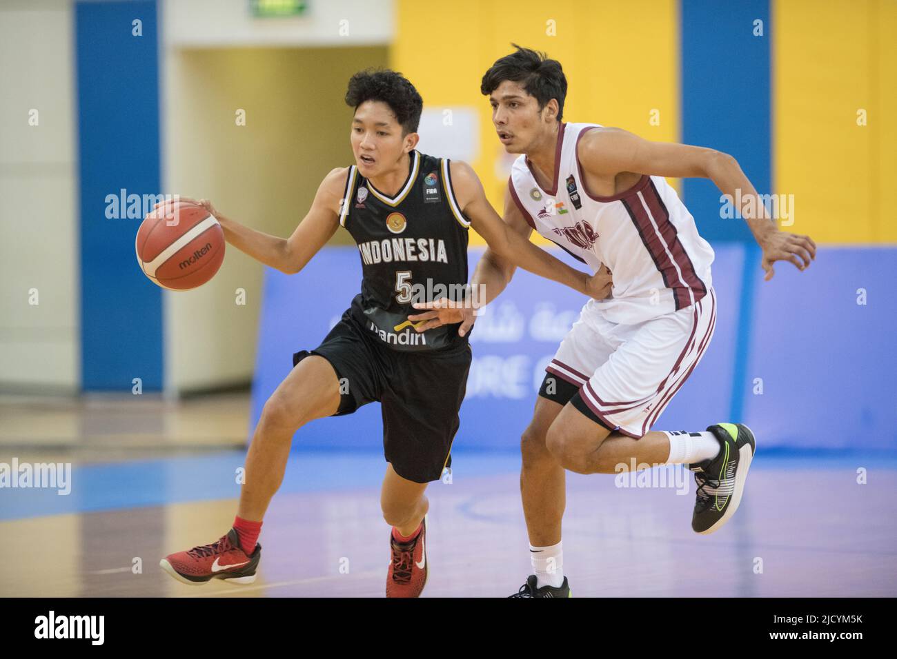 Doha, Qatar. 16th June, 2022. Radithyo Wibowo (L) of Indonesia Basketball team and Lokendra ...