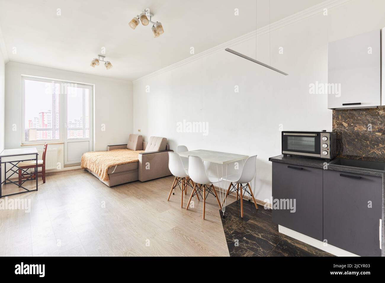 A cozy studio apartment with different decor Stock Photo - Alamy