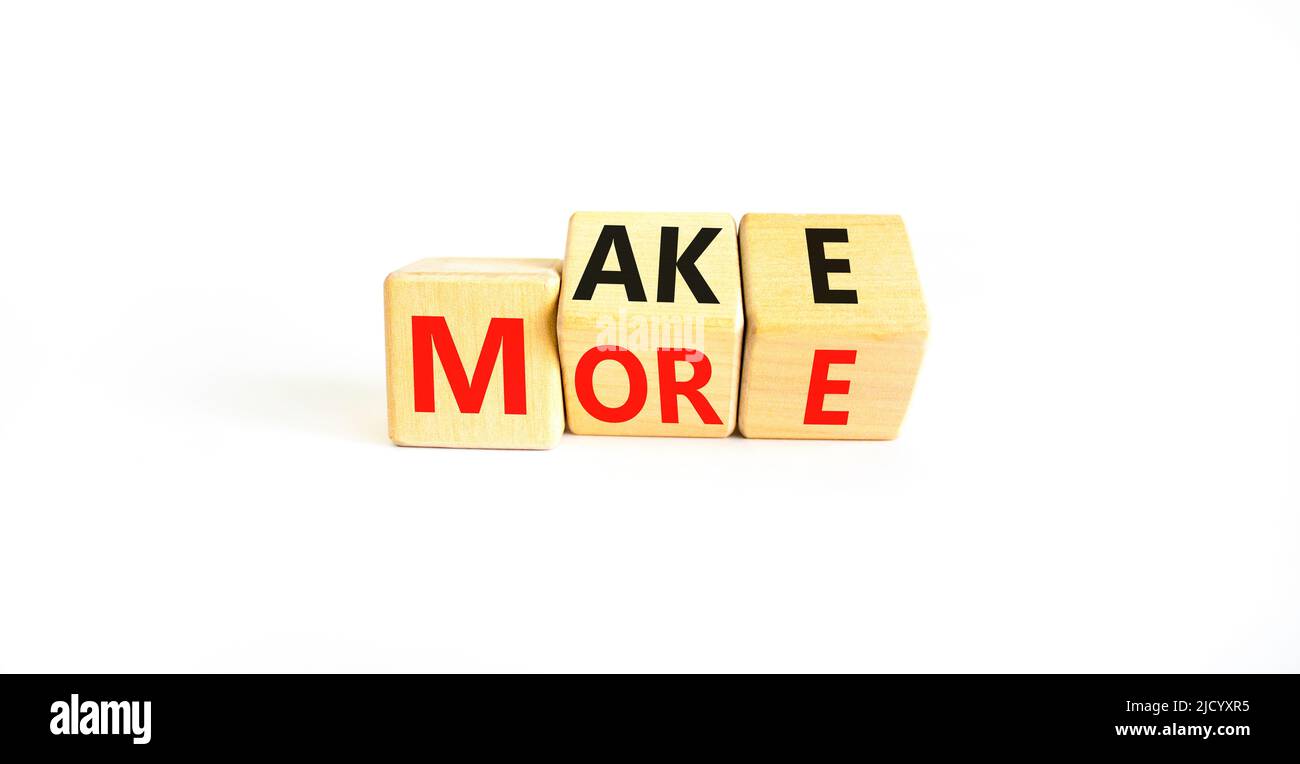 Make more symbol. Concept words Make more on wooden cubes. Beautiful ...