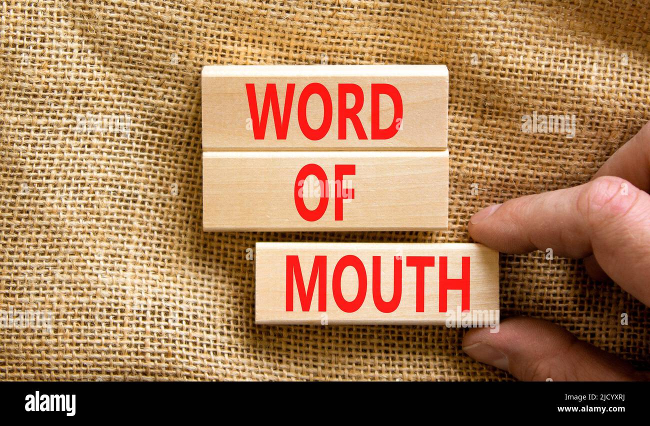 Word of mouth symbol. Concept words Word of mouth on wooden blocks on a ...