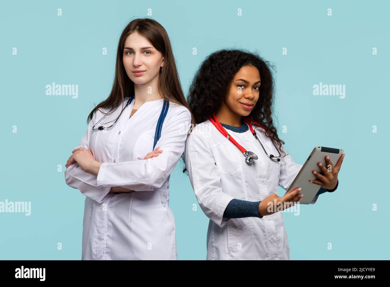 Portrait Two Female Doctors GP with Arms Crossed on Chest and Digital ...