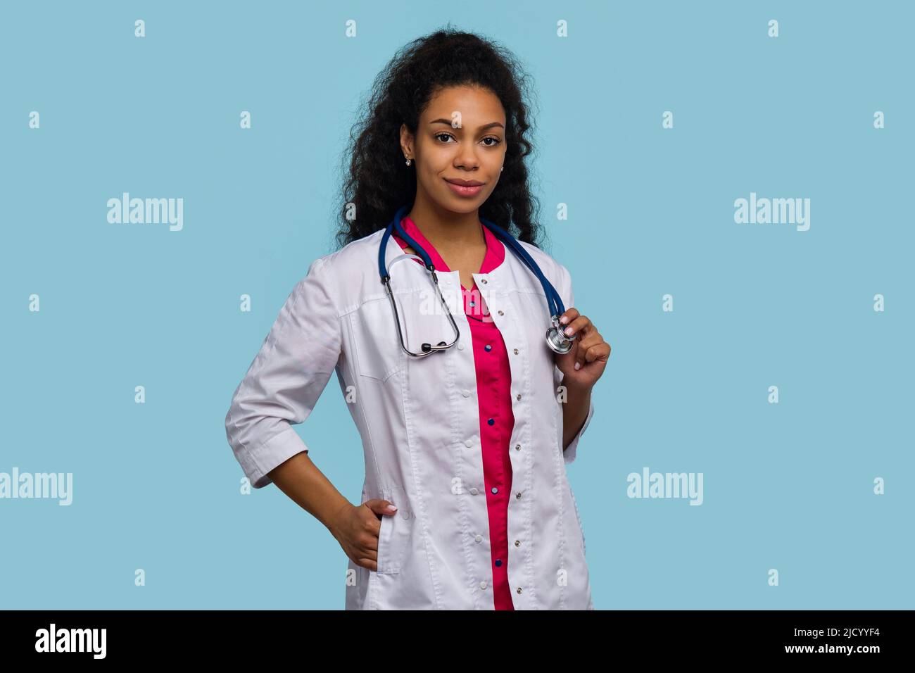 African American Female Doctor Medical Employee Posing on Blue Studio ...