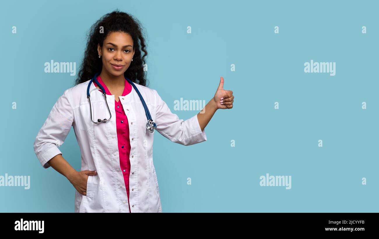 Non-Caucasian Skinned Woman Doctor Shows Approval Sign, Thumb Up, Like ...