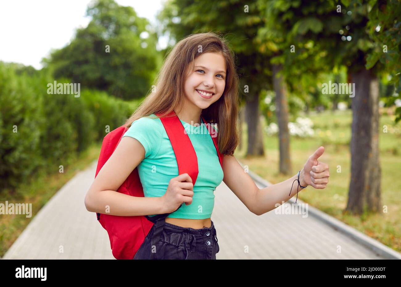 Teen girl thumbs up hi-res stock photography and images - Alamy