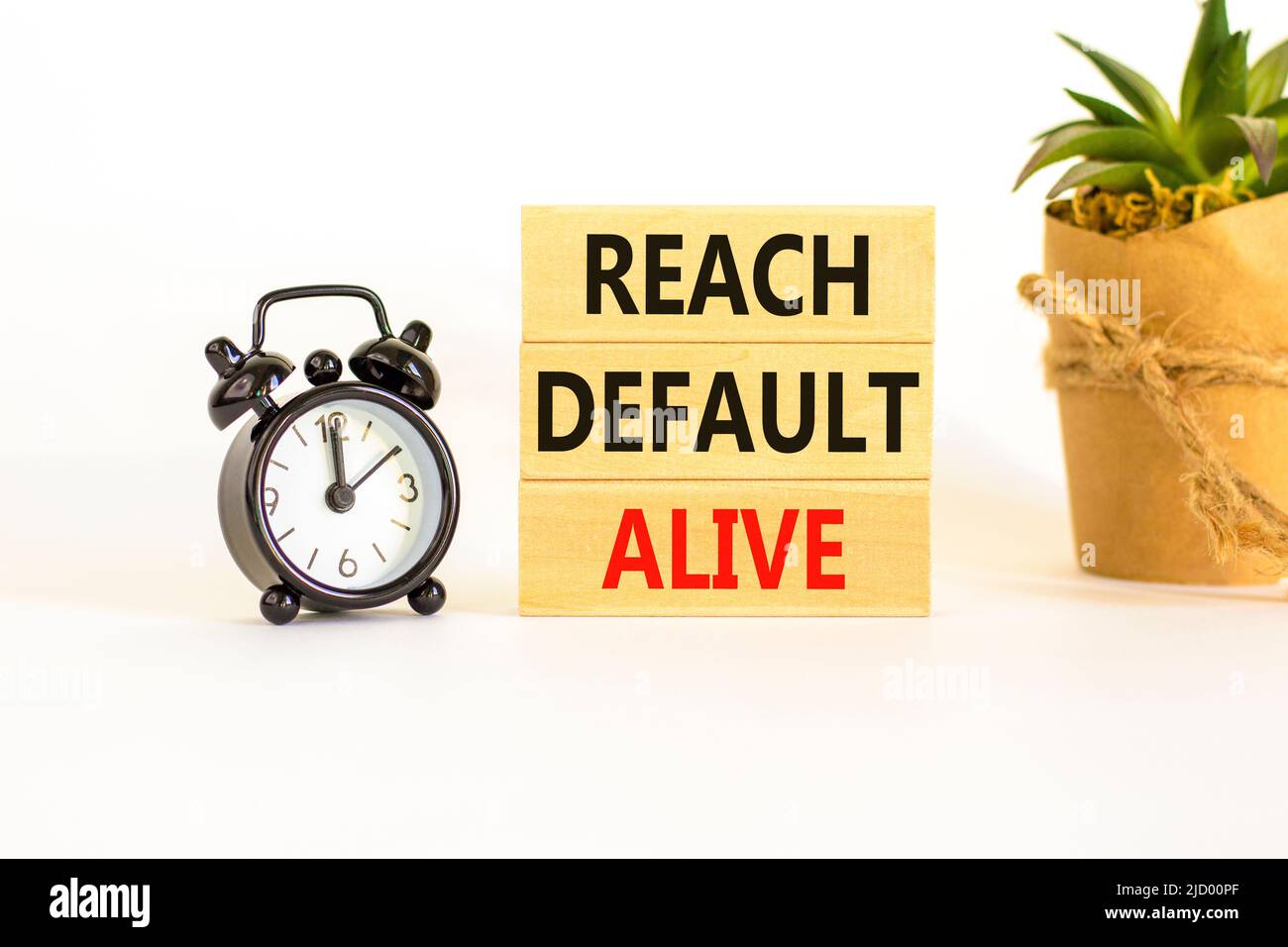 Reach default alive symbol. Concept words Reach default alive on wooden ...