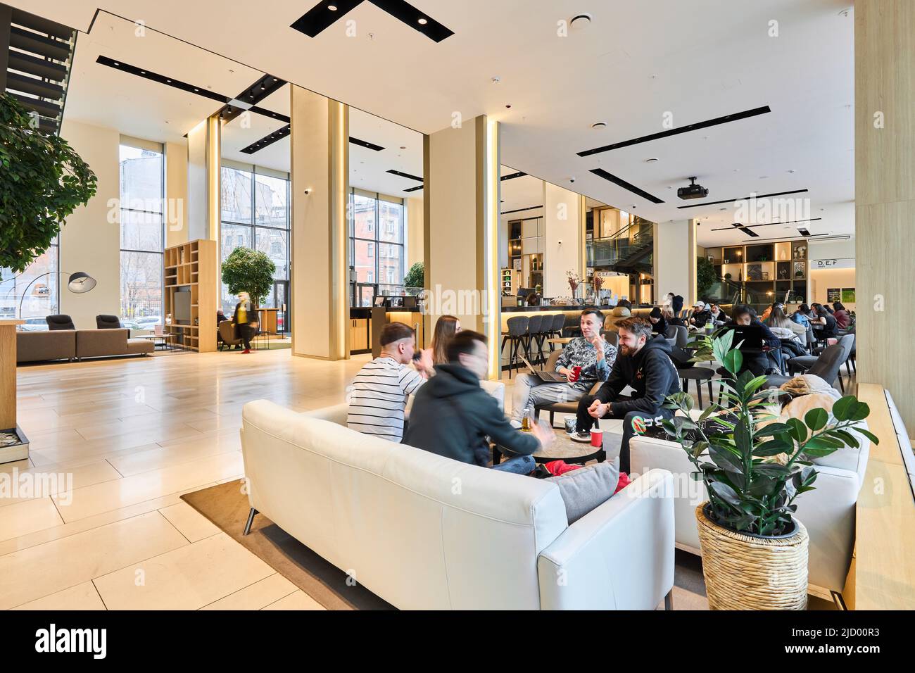 Entrance group of apart hotel with people Stock Photo - Alamy