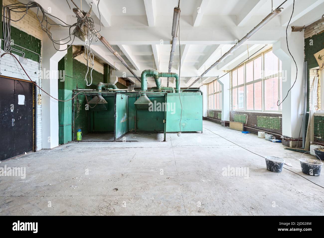 Old abandoned brick building with green walls Stock Photo - Alamy