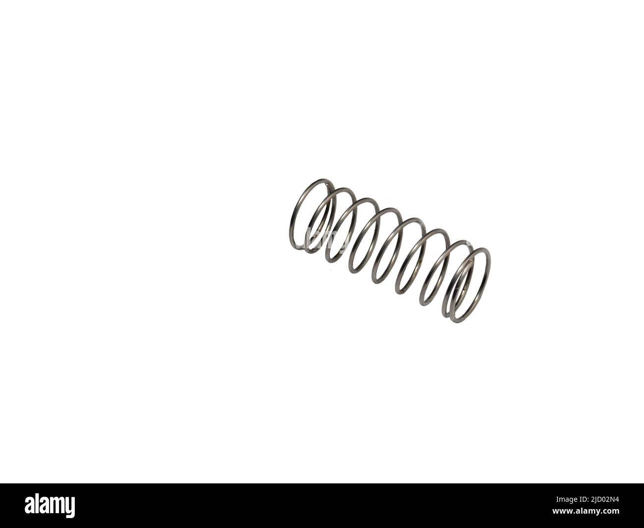 Metal spring on a white background. Mechanism element Stock Photo - Alamy