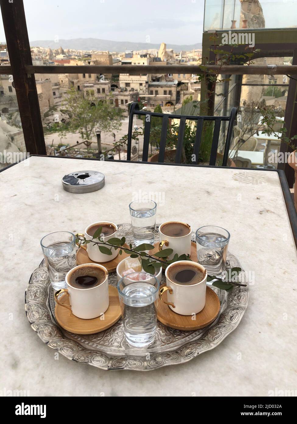 Four white cups of Turkish coffee on a silver tray. Traditional Turkish ...
