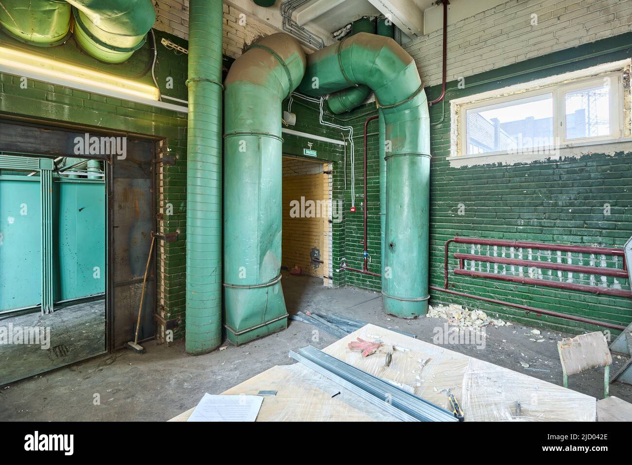 Old abandoned brick building with green walls Stock Photo - Alamy