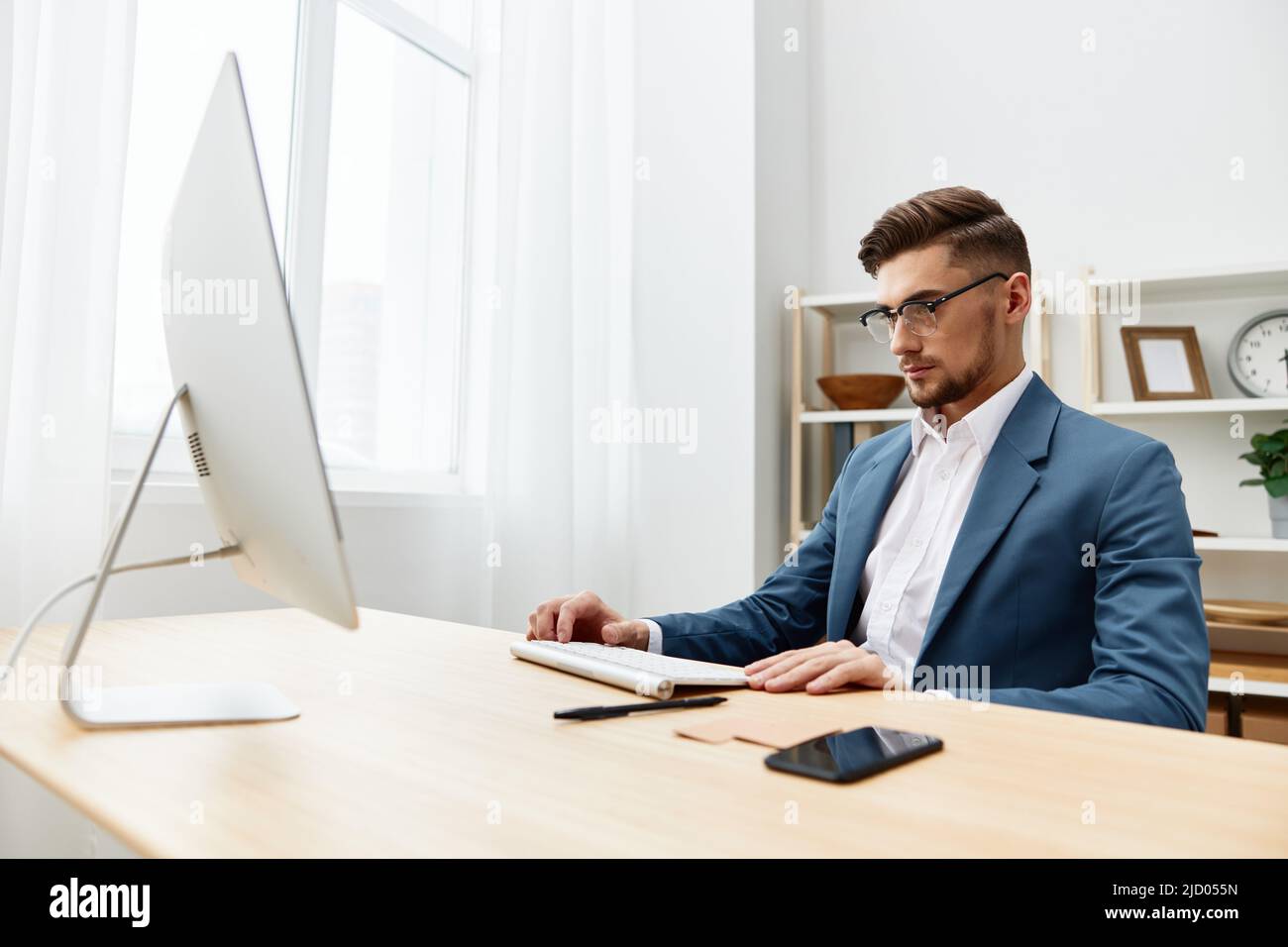 manager at the desk in the office an official isolated background Stock ...