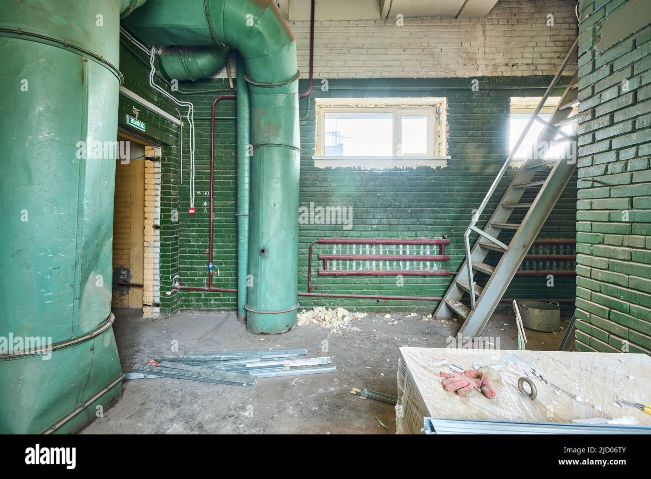 Old abandoned brick building with green walls Stock Photo - Alamy