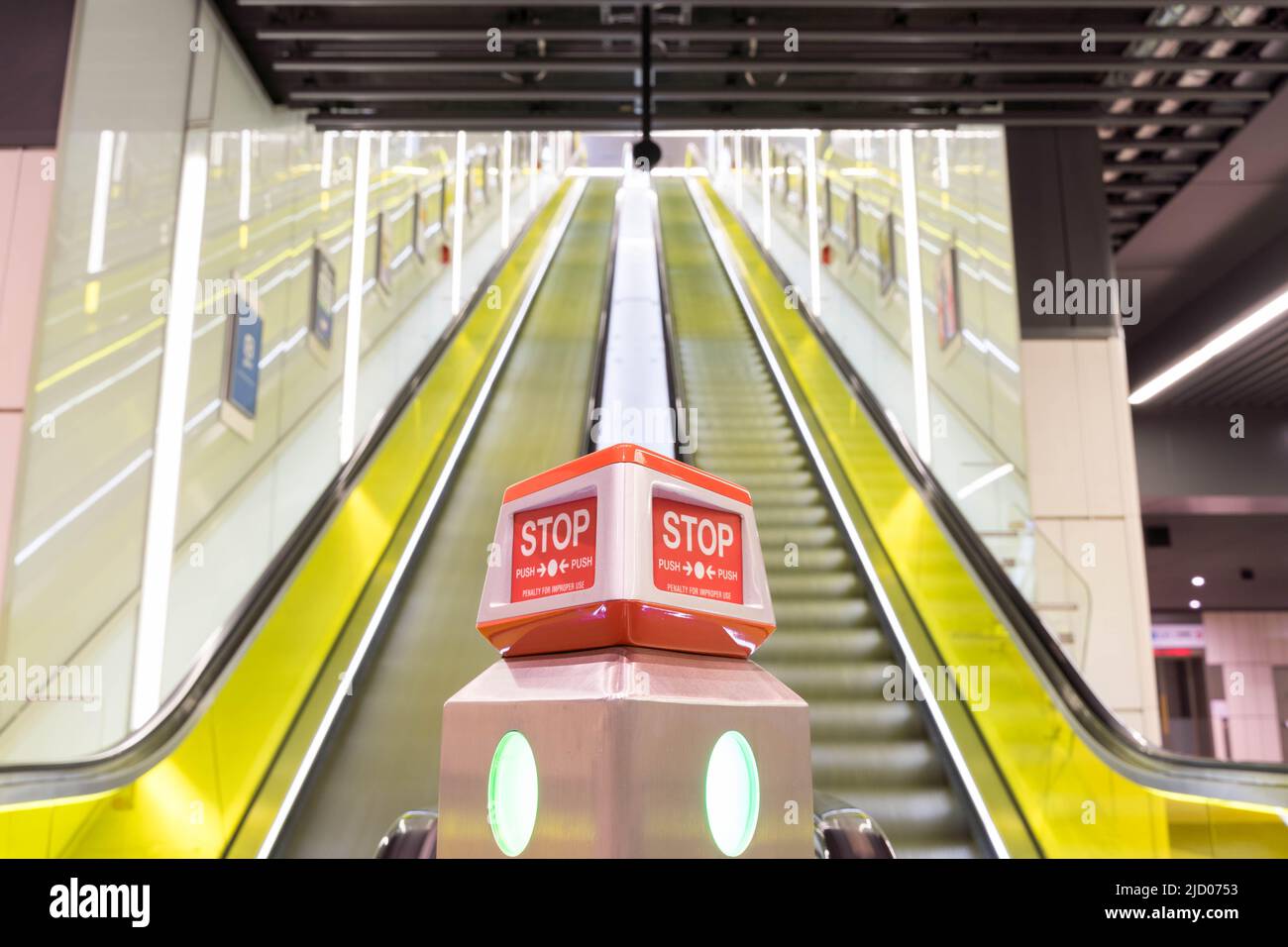 Escalators illuminated in yellow at Elizabeth line station London ...