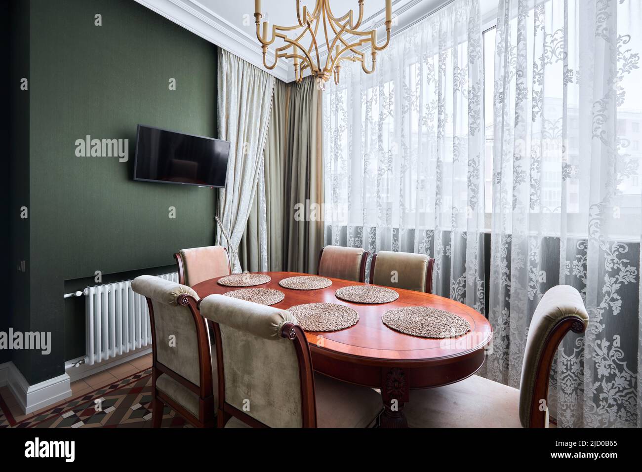 Dinner table in the evening without serving Stock Photo - Alamy