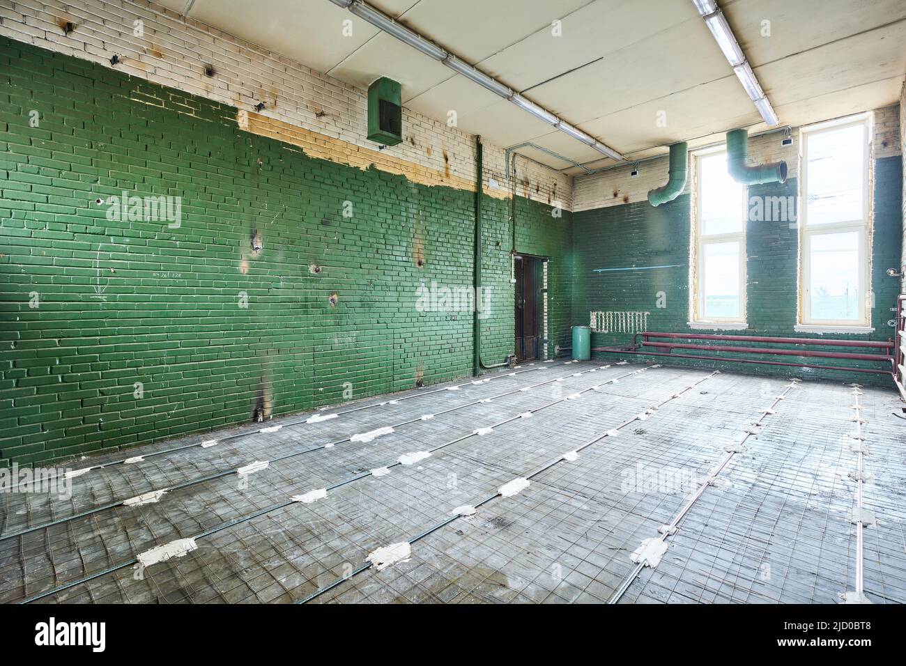Old abandoned brick building with green walls Stock Photo - Alamy