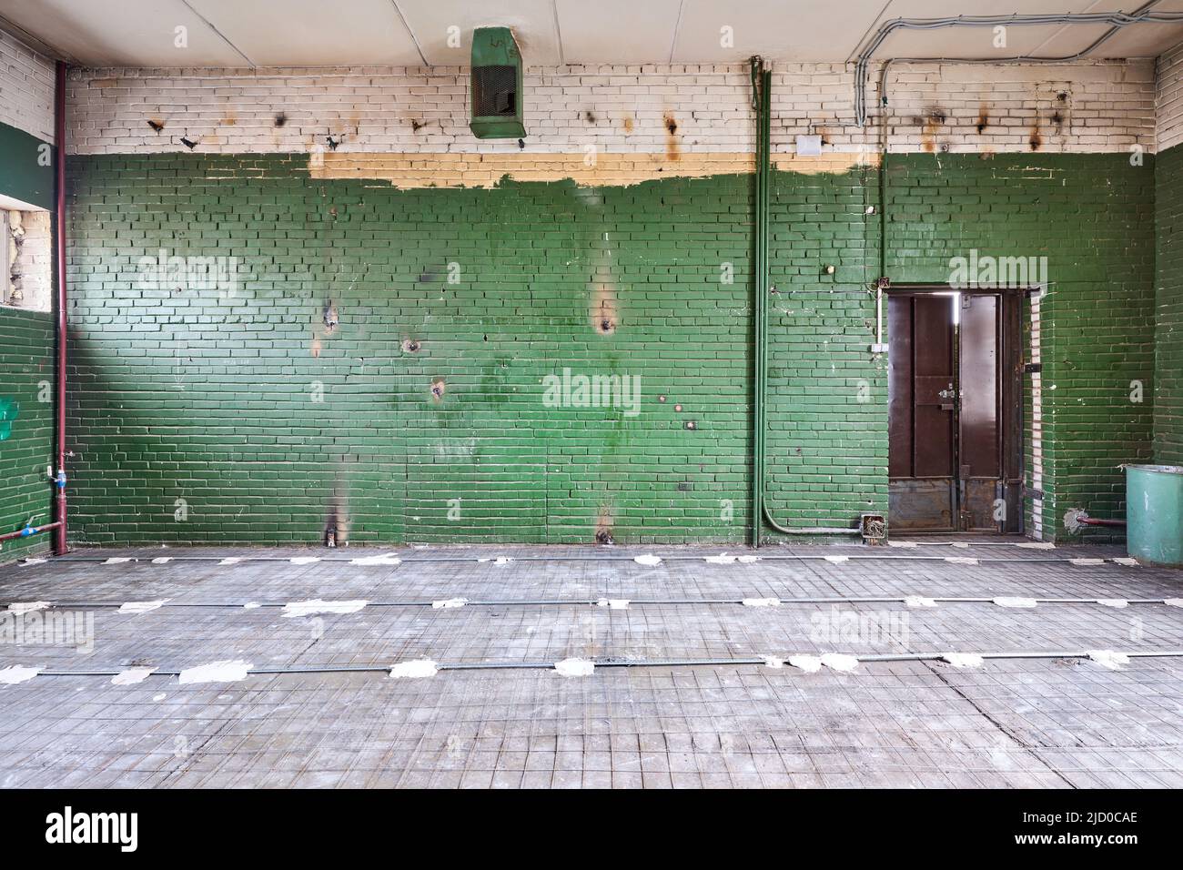 Old abandoned brick building with green walls Stock Photo - Alamy