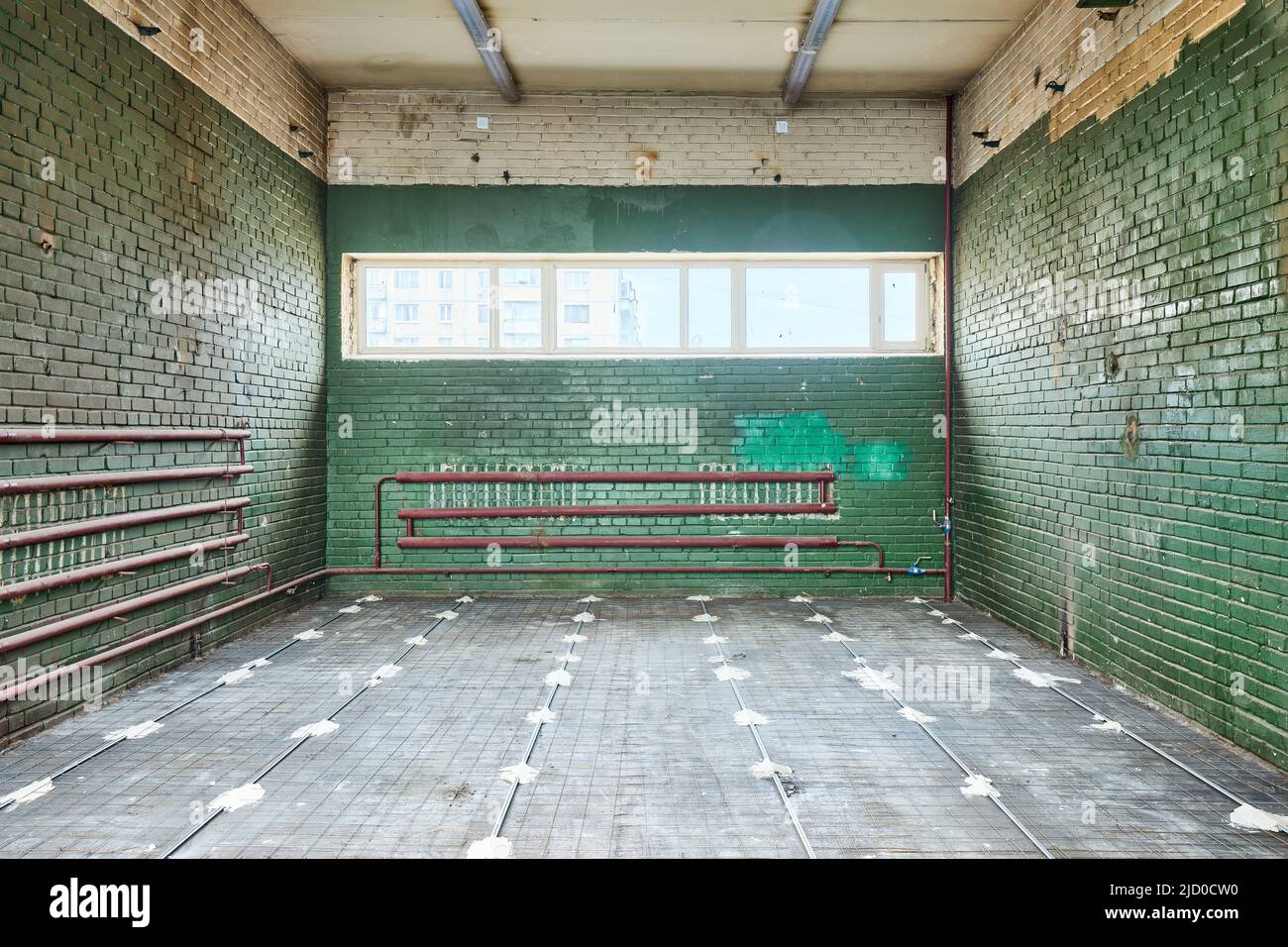 Old abandoned brick building with green walls Stock Photo - Alamy