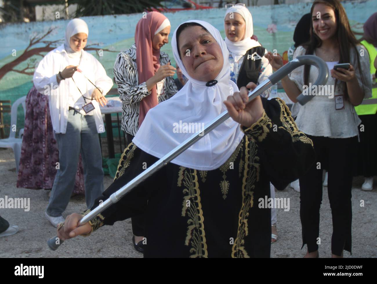 Palestinian elderly woman wears the old Palestinian traditional dress ...