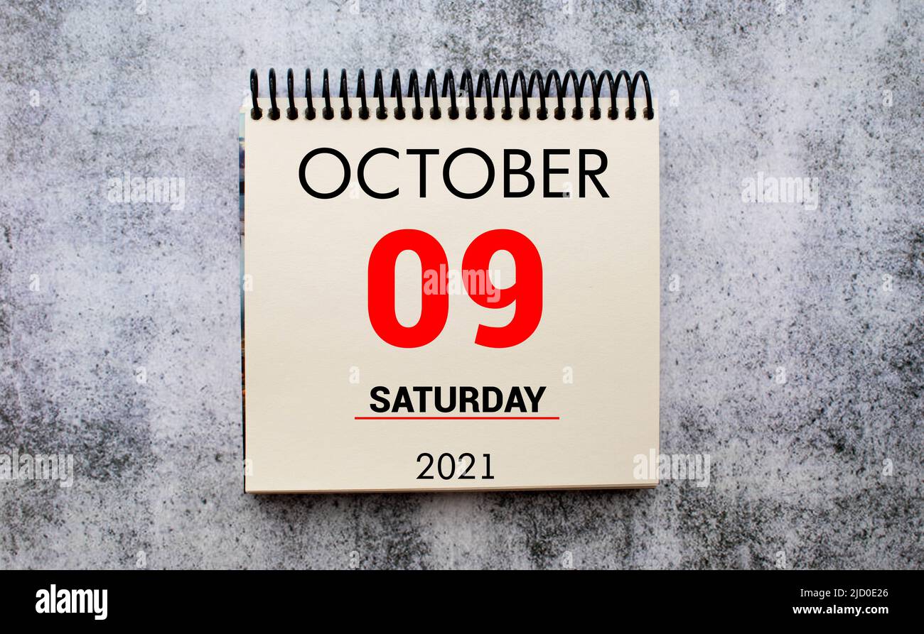 Wall calendar with a red pin - October 09 Stock Photo - Alamy