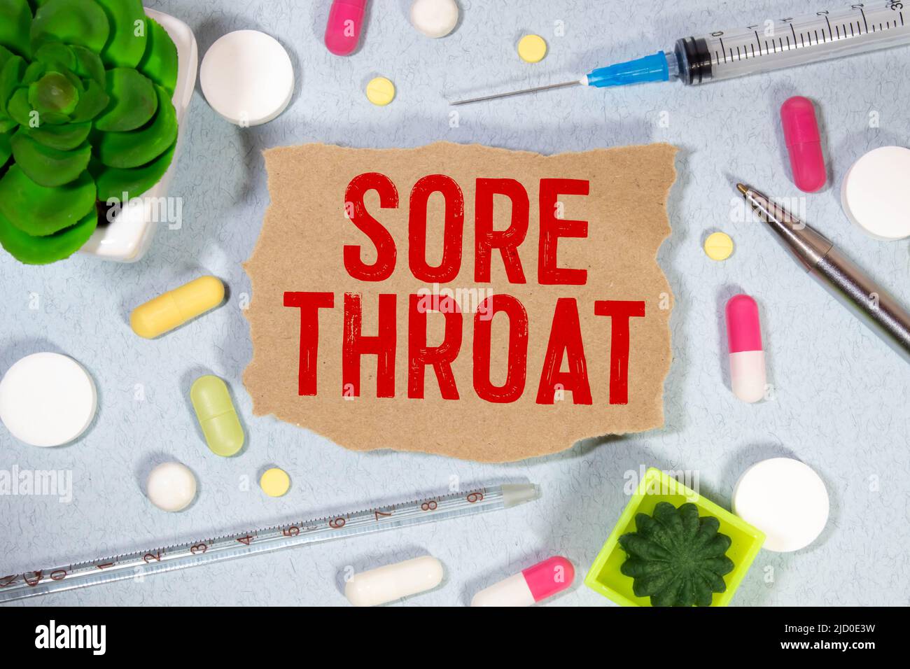 Sore throat inscription. Medical text or words Stock Photo - Alamy