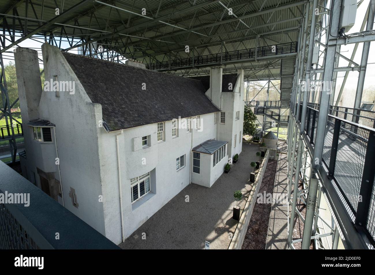 Hill House in protective steel mesh box. House designed in British Art ...