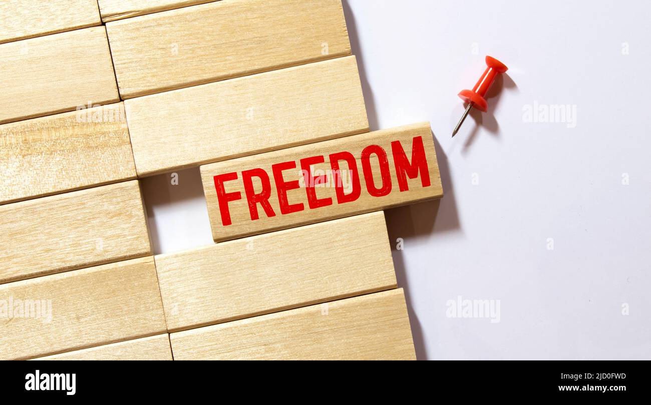 Two-directional metal signpost indicating Freedom Stock Photo - Alamy