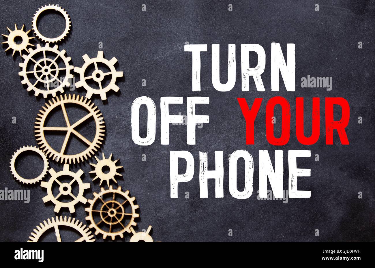 Business man pointing the text: Turn Off Your Phone Stock Photo - Alamy