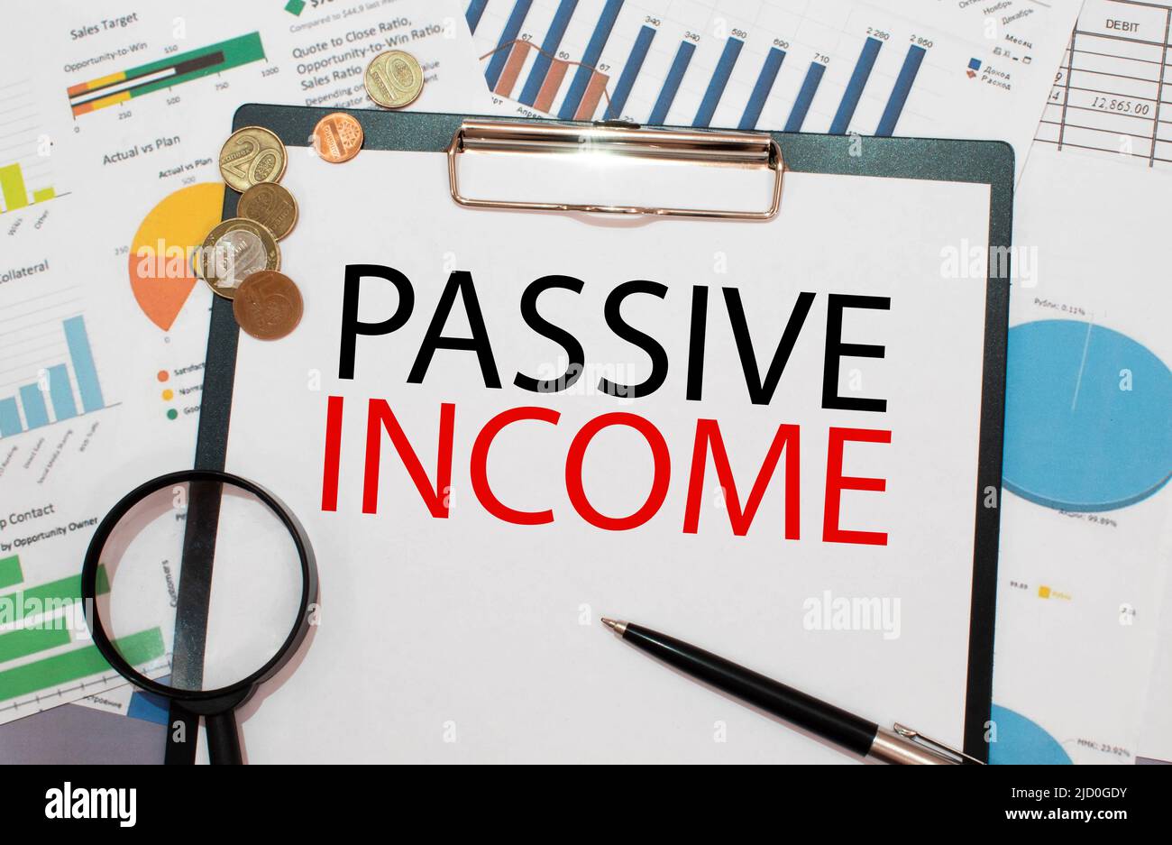 Passive Income Words on tag with dollar note and calculator on wood ...