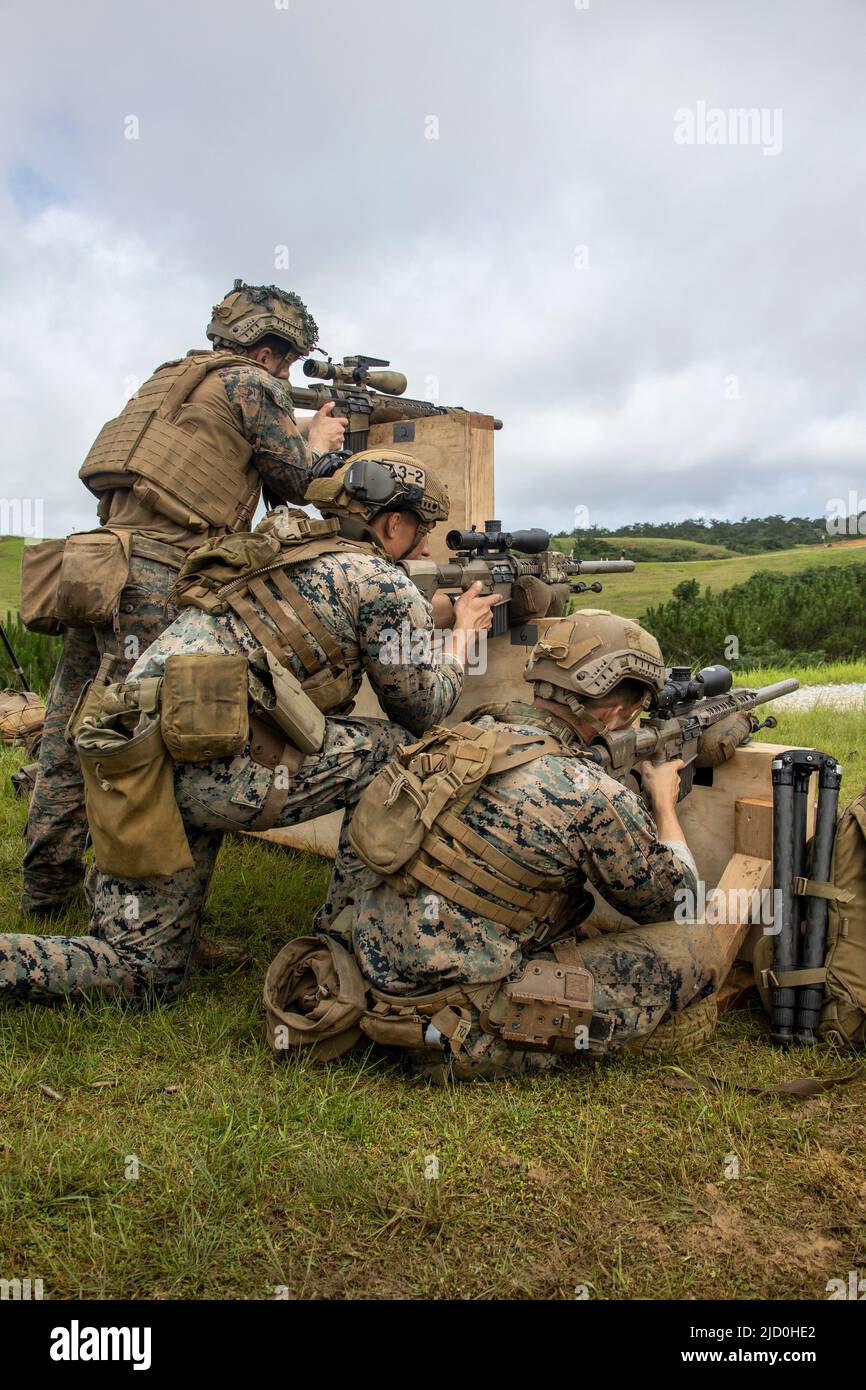 U.S. Marines with III Marine Expeditionary Force engage targets with ...