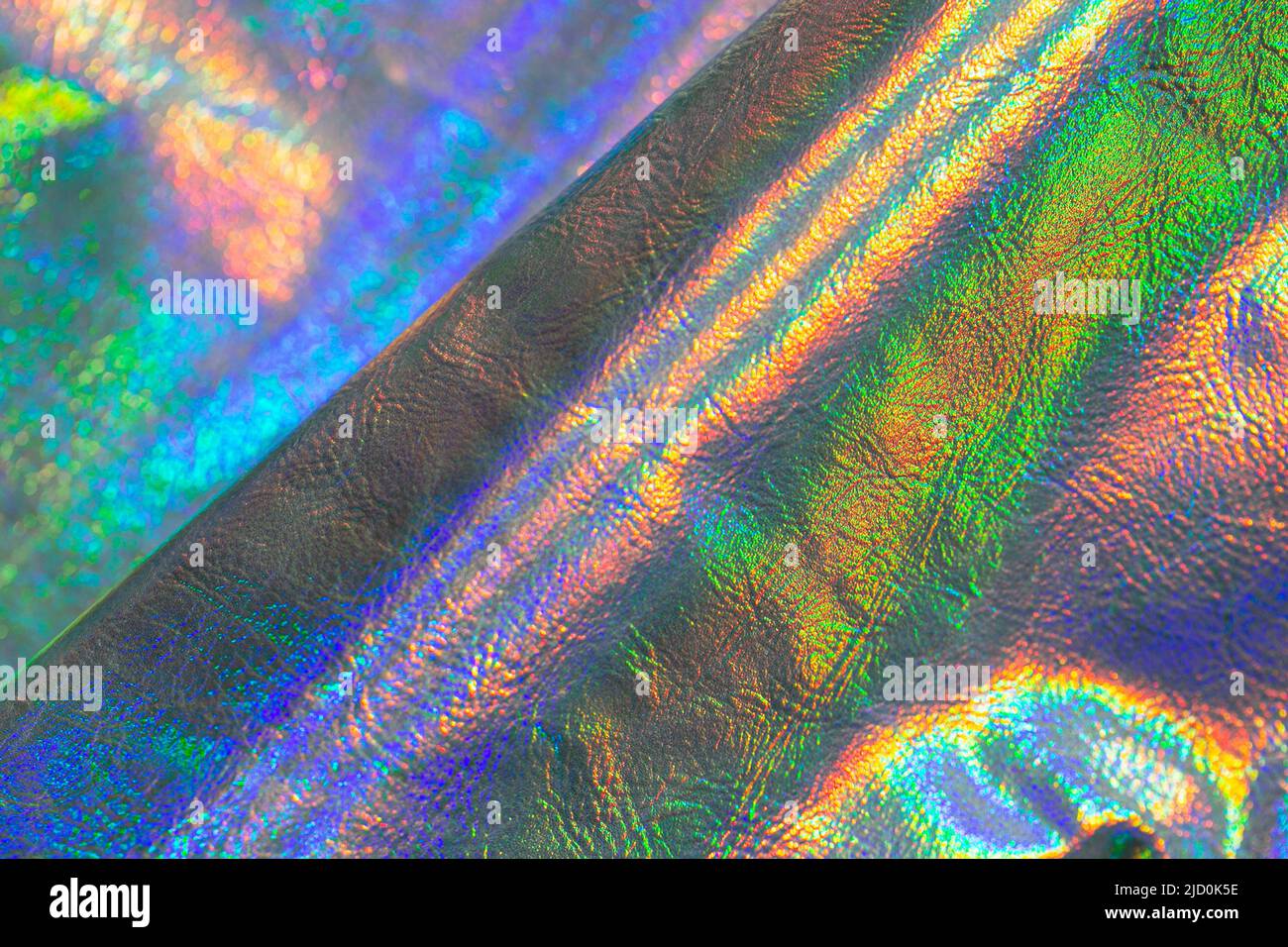 Holographic texture with iridescent waves and folds.beautiful metallic ...
