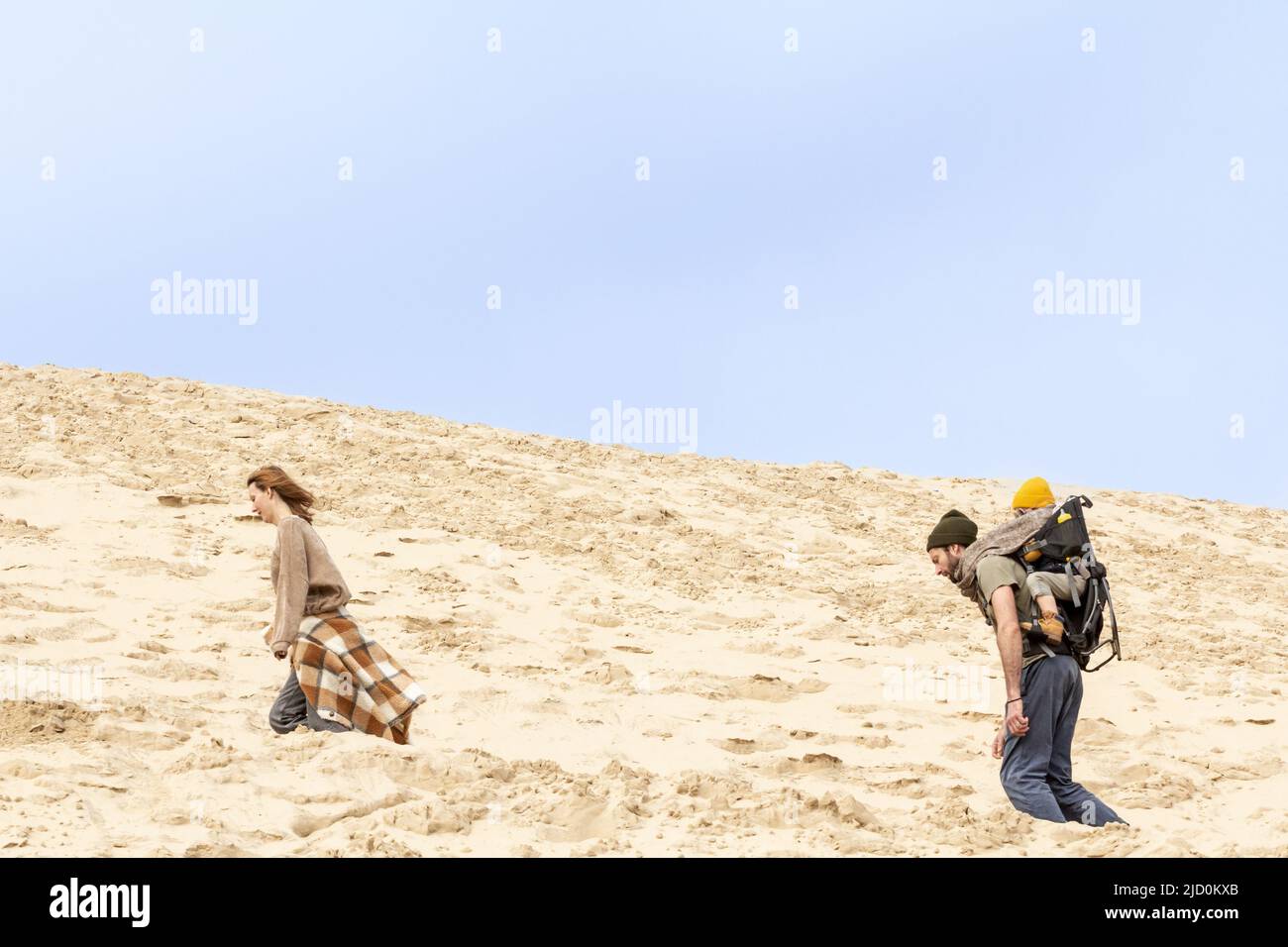 Picture of people, family of parents with children climbing the Pyla ...