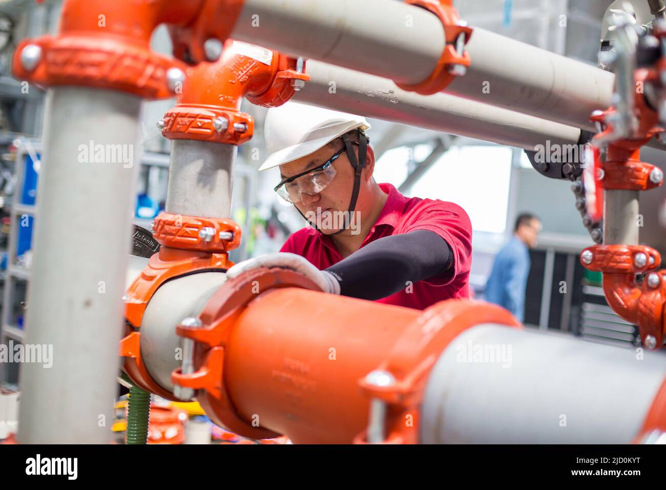 SUZHOU, CHINA - JUNE 16, 2022 - A worker produces air compressor ...