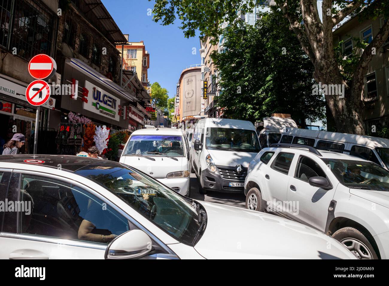 Picture of cars waiting, in a traffic jam, driving in a small street of ...