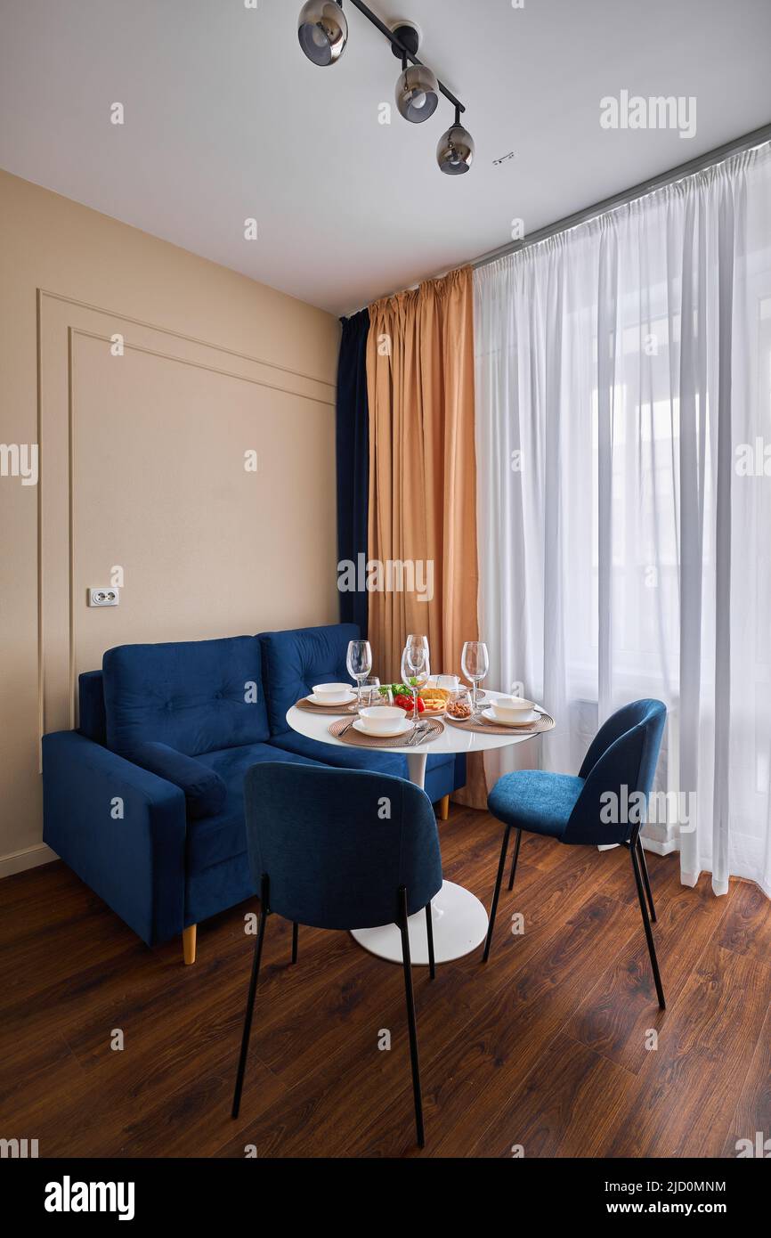 Beautiful table for four waiting for guests Stock Photo - Alamy