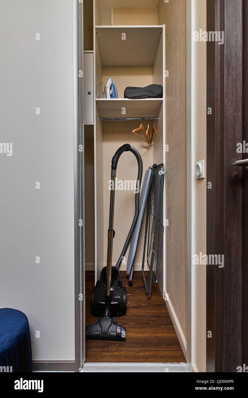 Photo of the closet with vacuum cleaner inside Stock Photo - Alamy