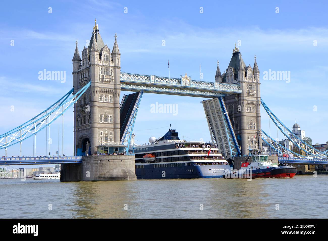 London, UK. The Navigator cruise ship passes through Tower Bridge on ...