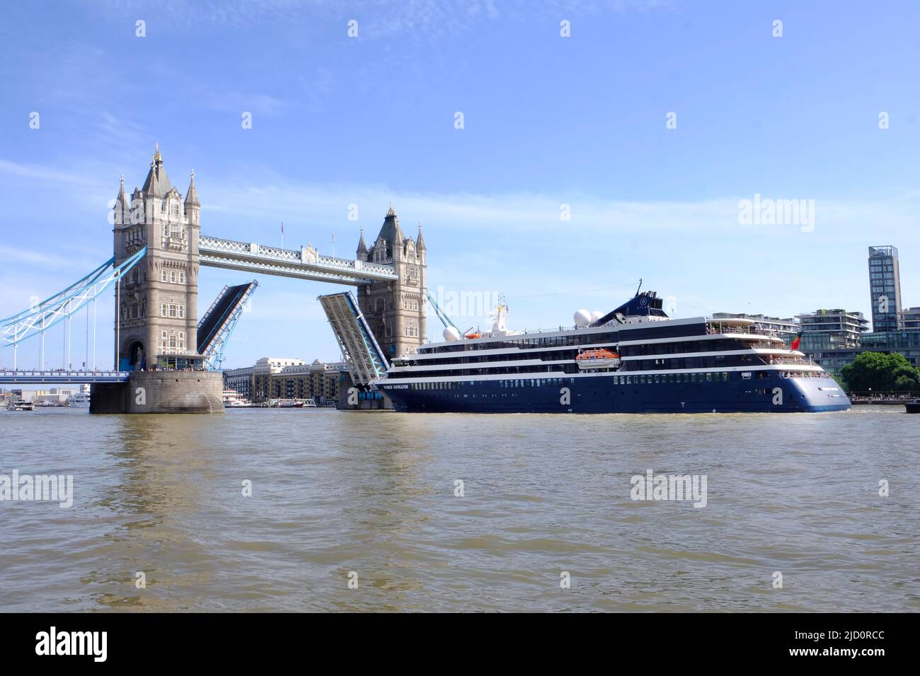 London, UK. The Navigator cruise ship passes through Tower Bridge on ...