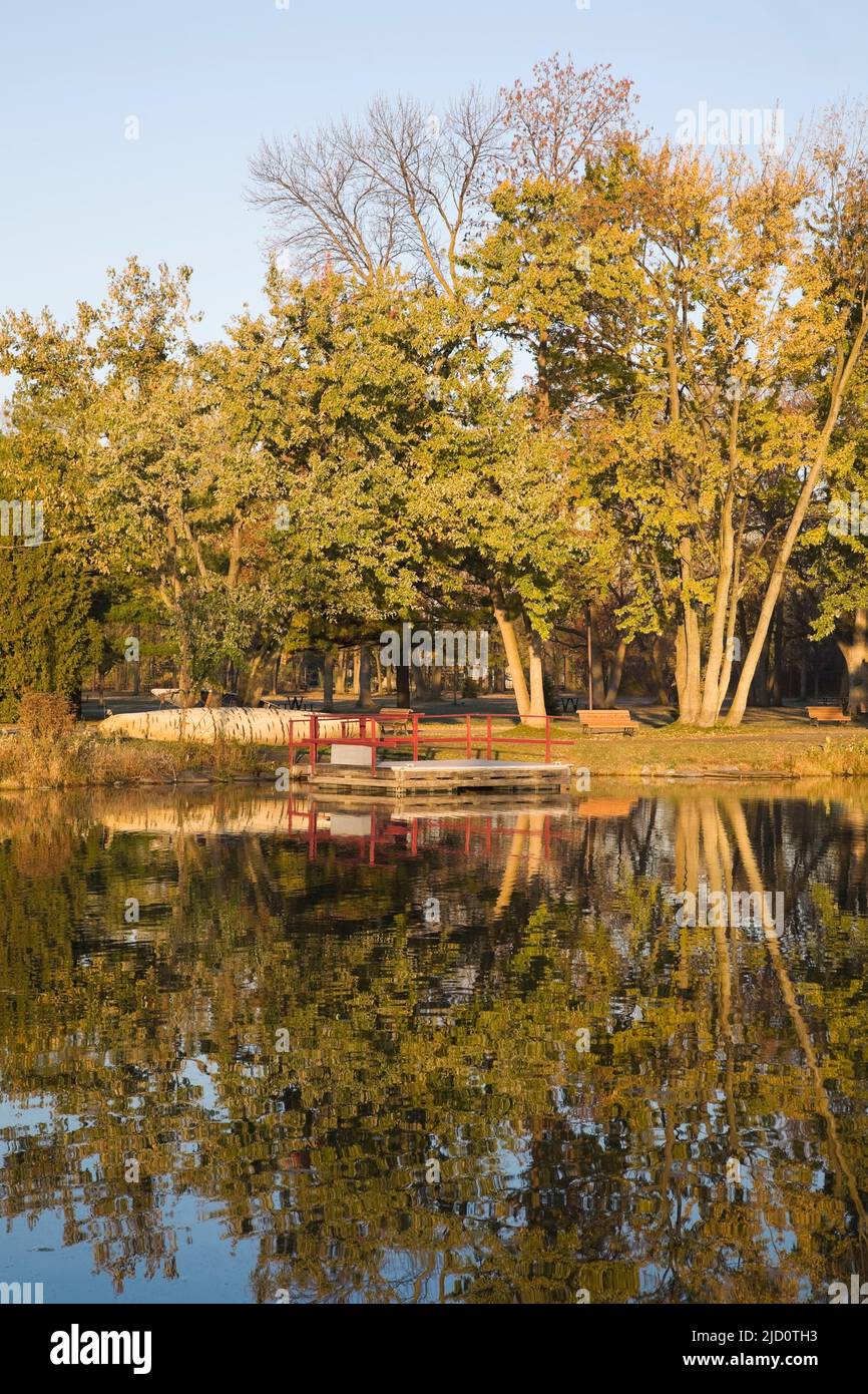 Dock on Riviere des Mille-Iles in autumn, Ile des Moulins Historical ...