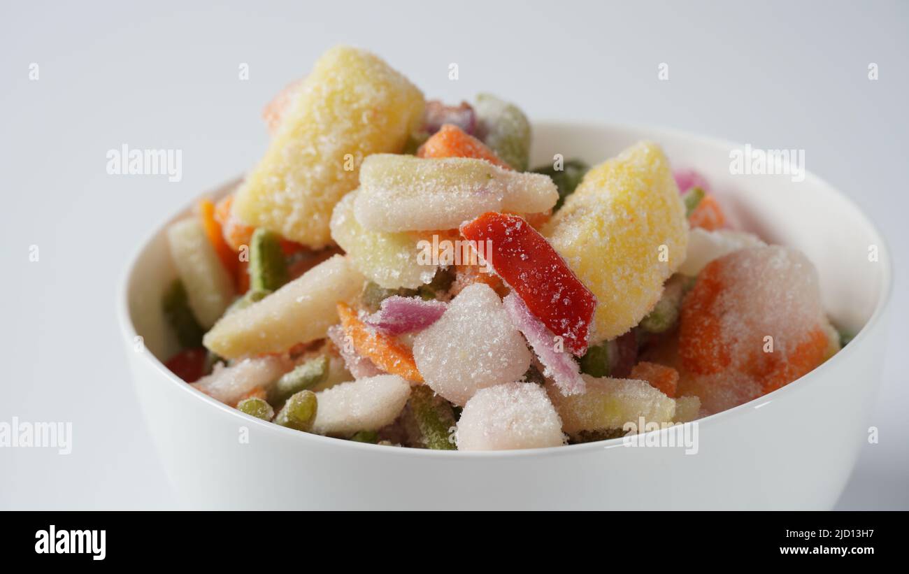 Homemade frozen various vegetables. Frozen vegetable mix on white ...