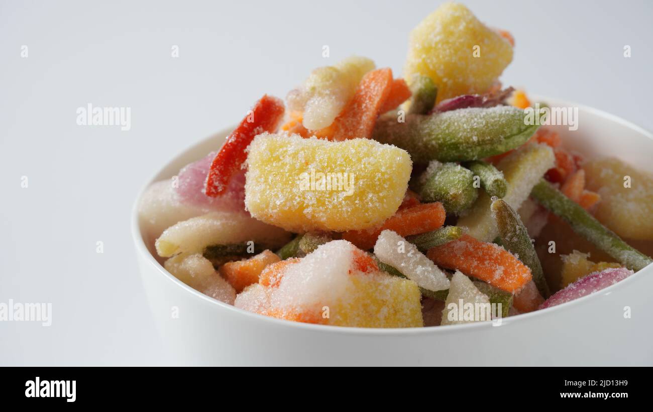 Homemade frozen various vegetables. Frozen vegetable mix on white ...